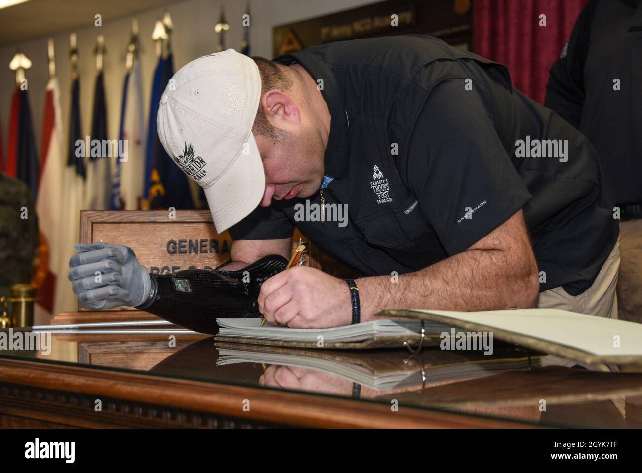 U.S. Army Master Sgt. (ret.) Leroy Petry signs the guest book at the ...