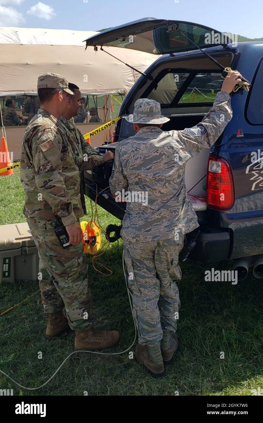 U.S. Airmen with the Puerto Rico Air National Guard provide support at ...