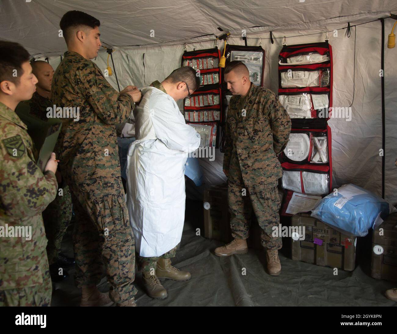 U.S. Navy Petty Officer 3rd Class Thomas Flournoy, right, and Petty ...