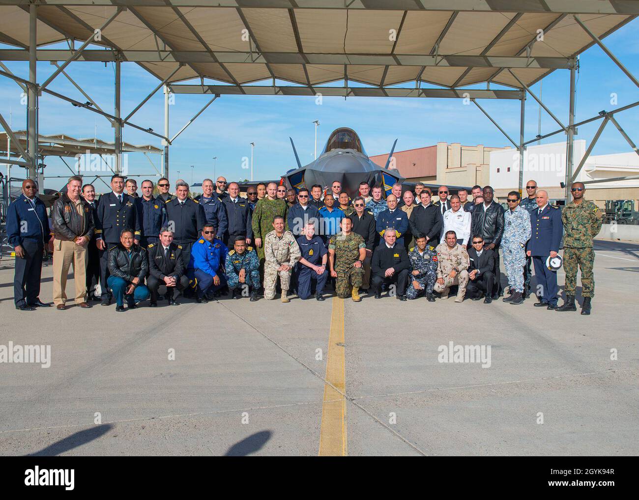 Students and staff from the Naval Command College pose with an F-35A ...