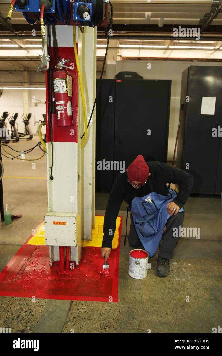 Jamie Hinojosa, Heavey Equipment Mechanic Journeyman, repaints a ...