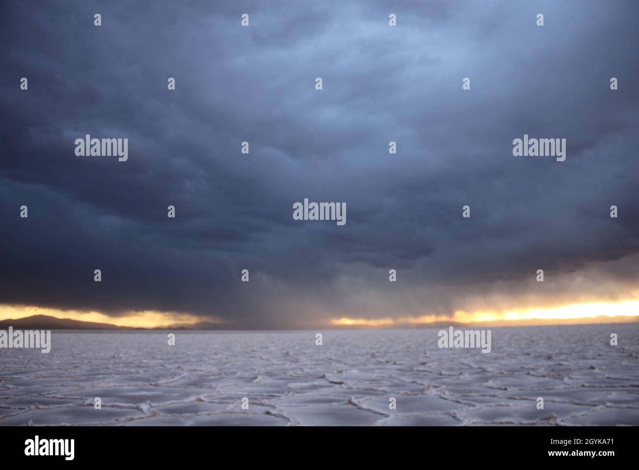 Storm at salt flat desert on sunset Stock Photo - Alamy