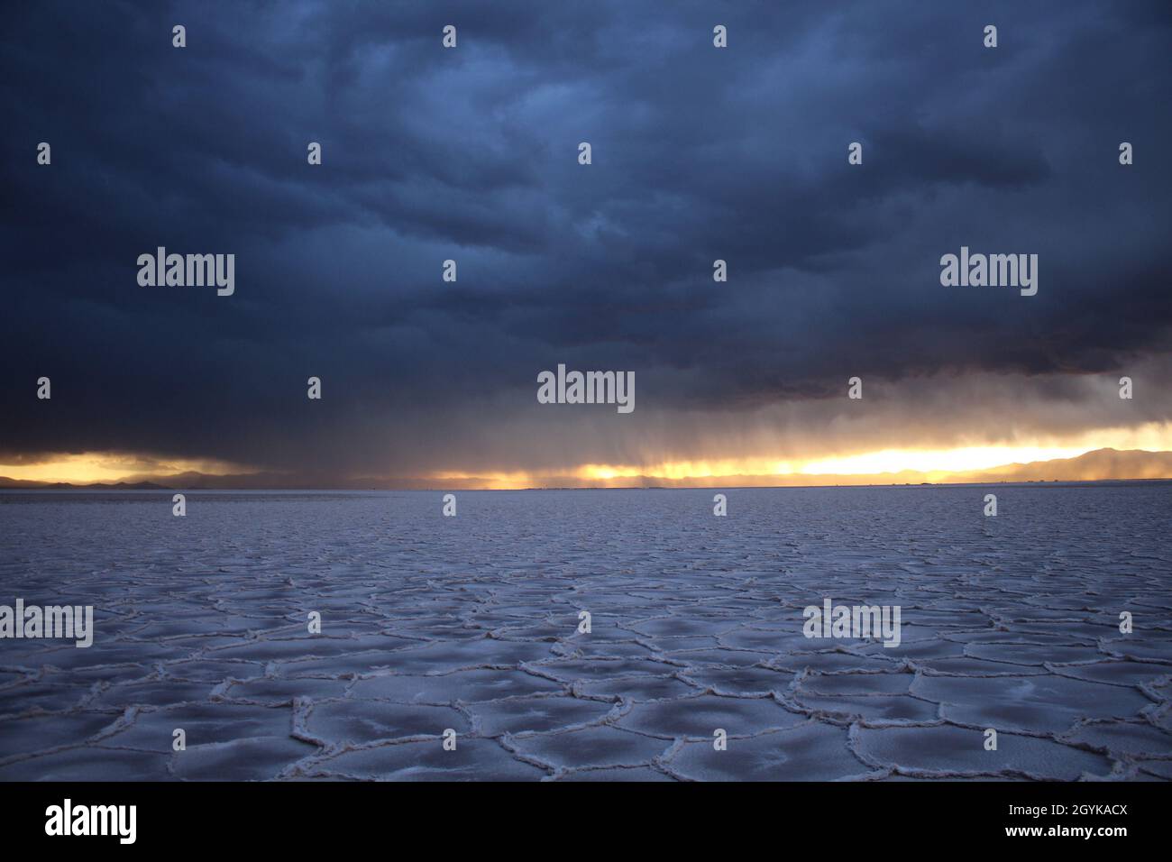 Storm at salt flat desert on sunset Stock Photo - Alamy