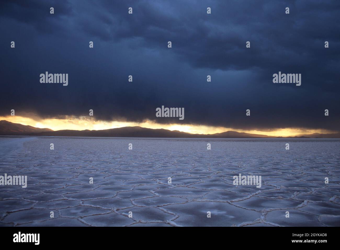 Storm at salt flat desert on sunset Stock Photo - Alamy