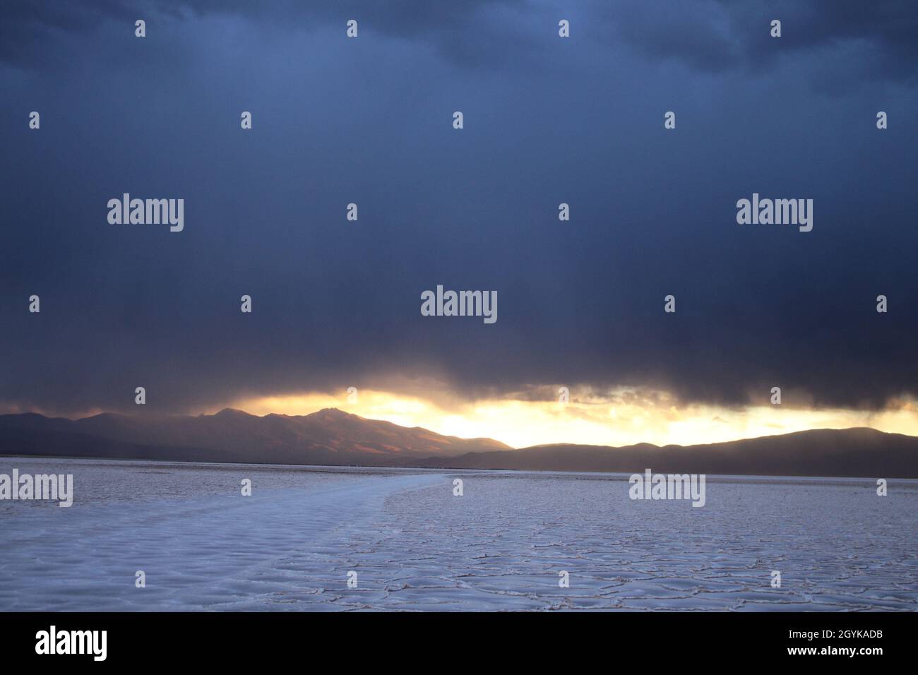 Storm at salt flat desert on sunset Stock Photo - Alamy