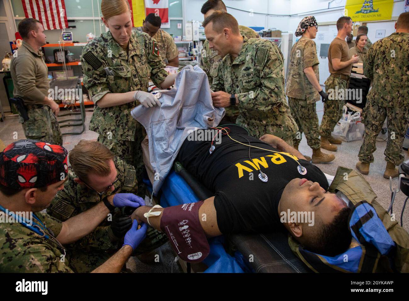 U.S. Sailors deployed from Naval Hospital Jacksonville, Florida, gather ...