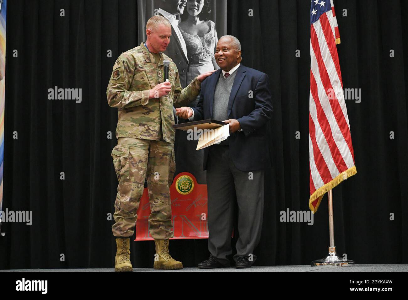 Col. Jon Eberlan, 75th Air Base Wing commander, presents Dr. Ronald ...