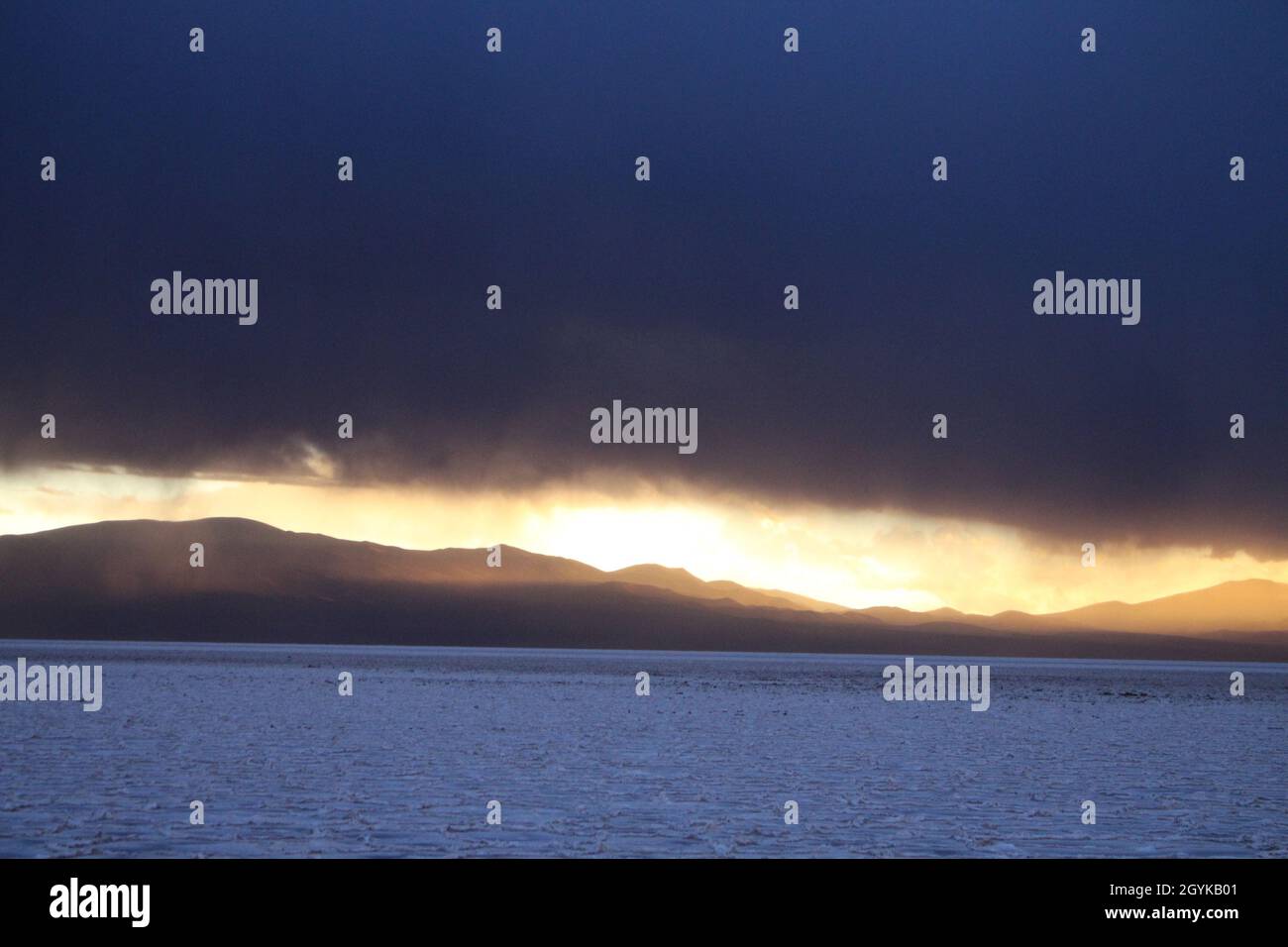 Storm at salt flat desert on sunset Stock Photo - Alamy