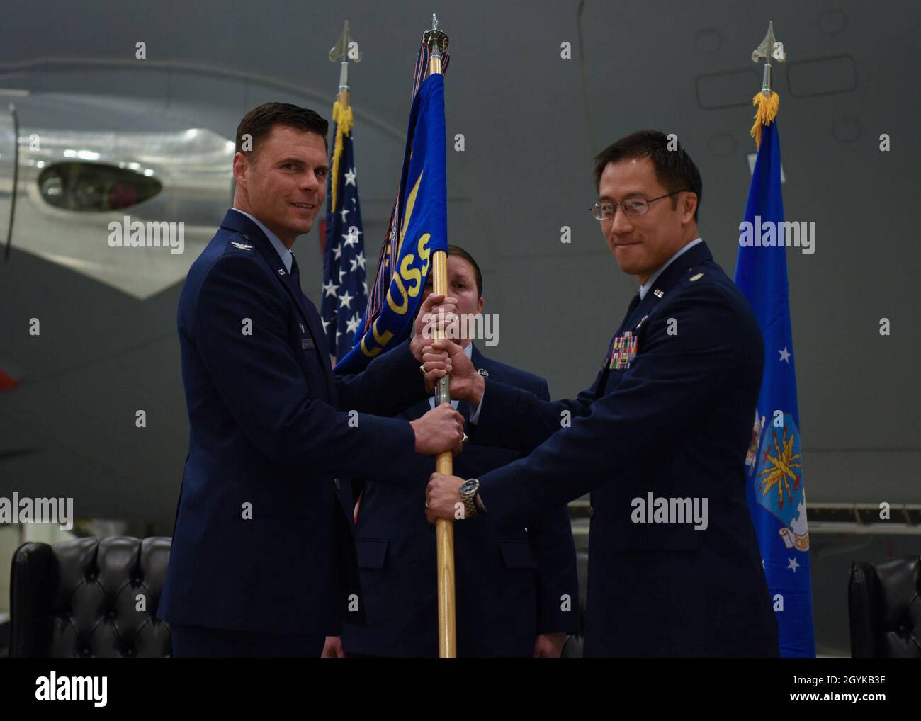 Col. Thad Middleton, 22nd Operations Group commander, passes the 22nd ...