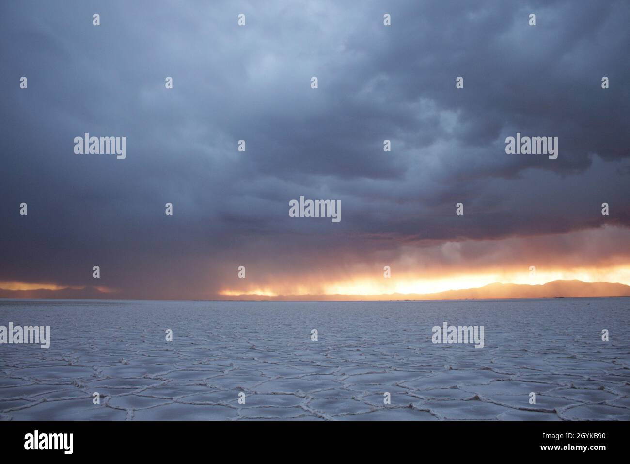 Storm at salt flat desert on sunset Stock Photo - Alamy