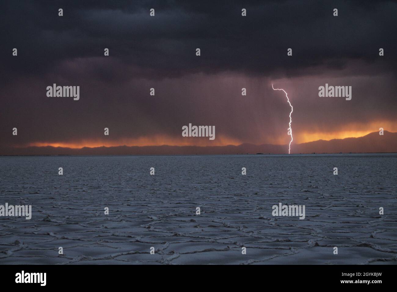 Storm at salt flat desert on sunset Stock Photo - Alamy
