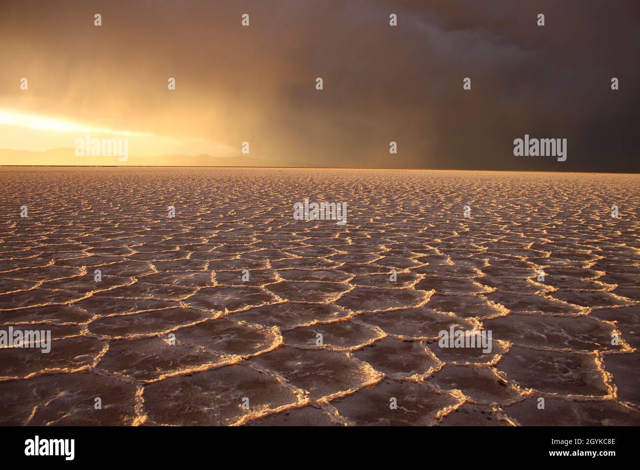 Storm at salt flat desert on sunset Stock Photo - Alamy