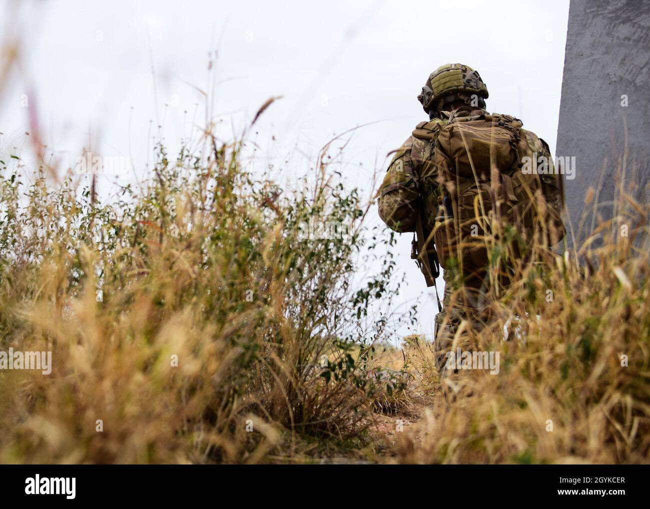 An Airman assigned to the 355th Civil Engineer Squadron stands guard ...