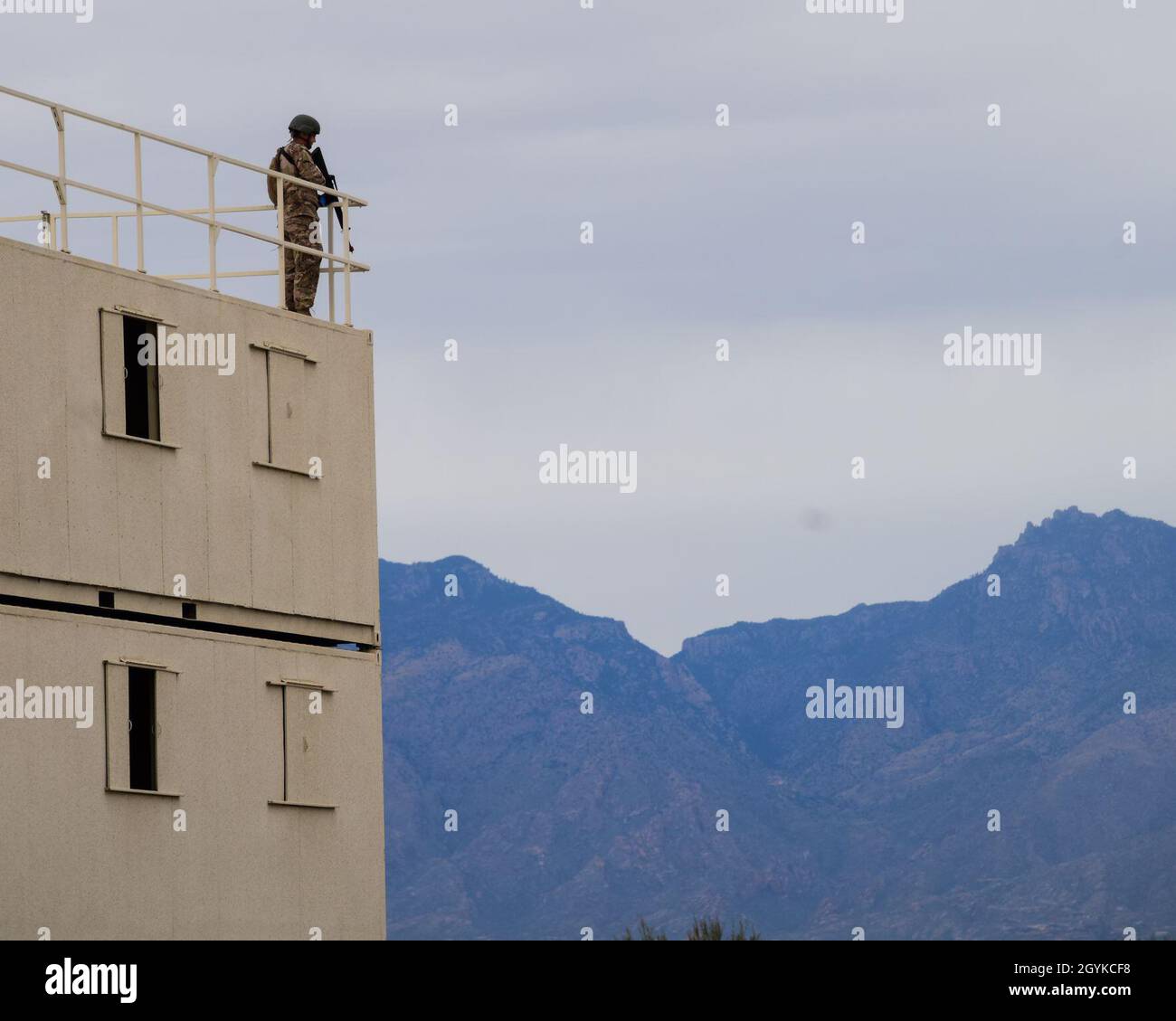 An Airman assigned to the 355th Civil Engineer Squadron stands guard ...