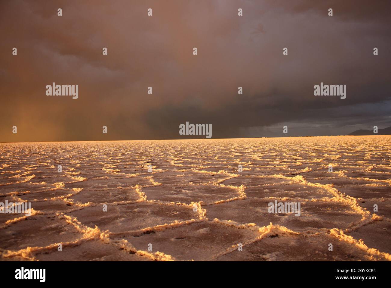 Storm at salt flat desert on sunset Stock Photo - Alamy