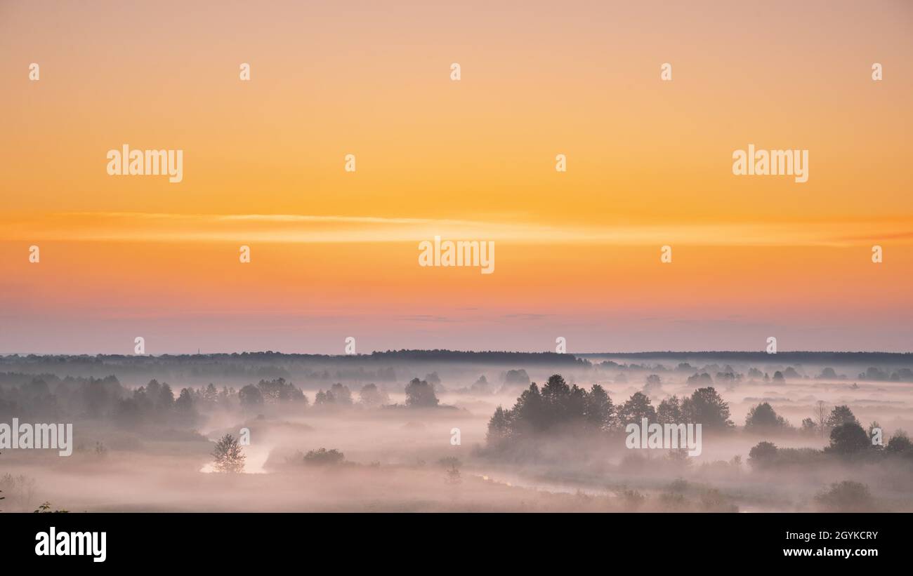 Amazing Sunrise Over Misty Landscape. Scenic View Of Foggy Morning Sky ...