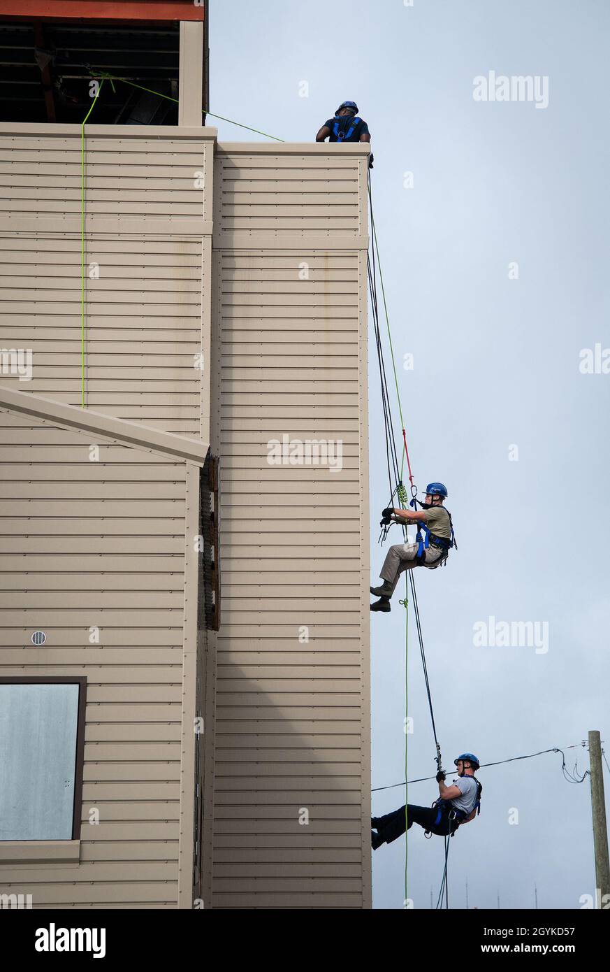 Rescue technician course trainees practice ascending a four-story ...