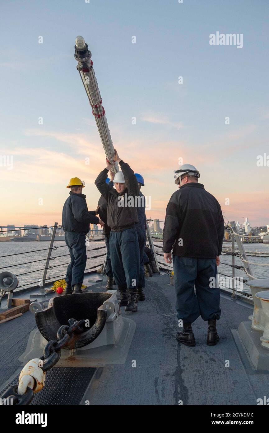 SAN DIEGO (Jan. 17, 2020) Sailors take down the jackstaff aboard the ...