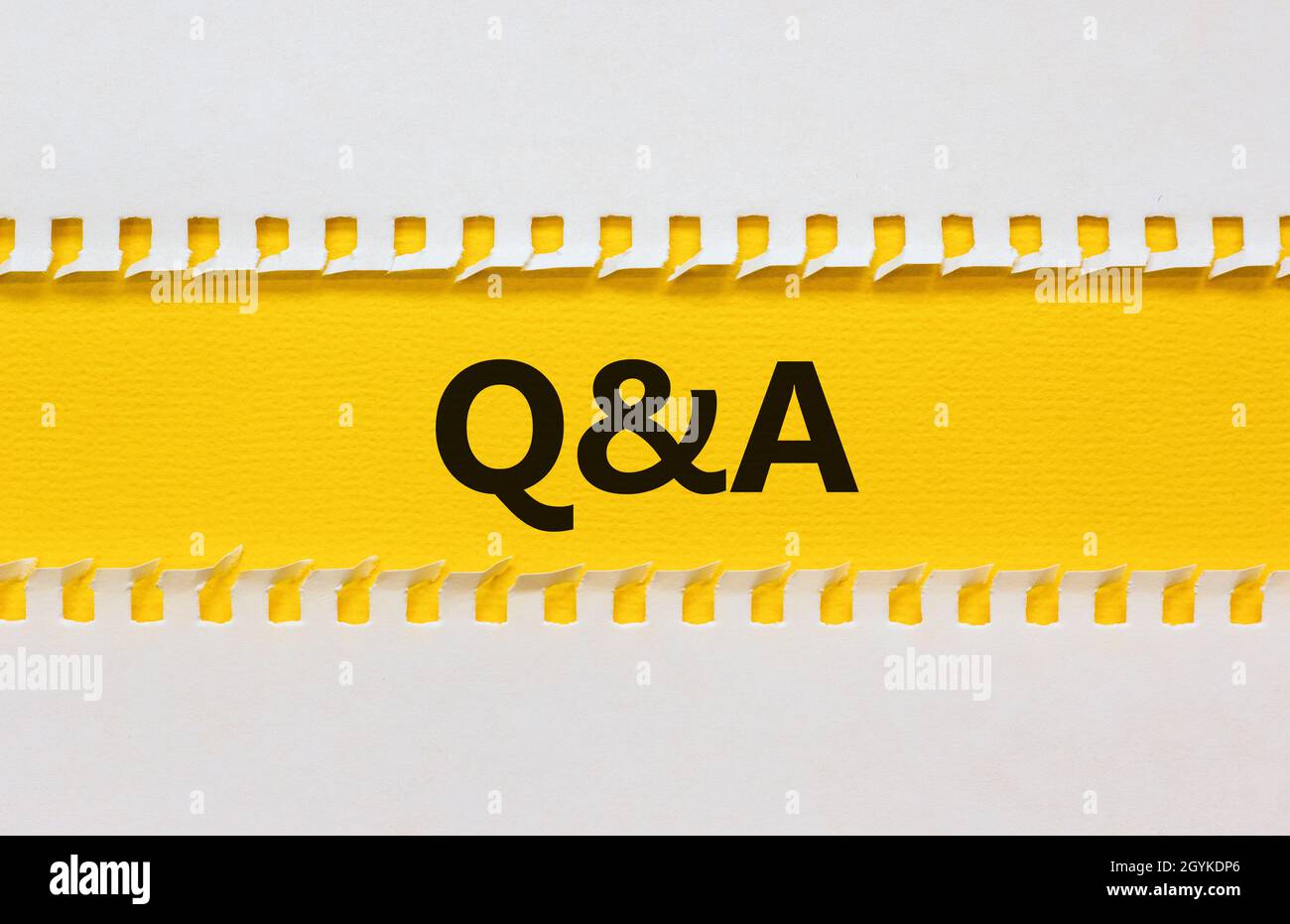 Questions and answers symbol. White and yellow paper. Words 'Q and A ...