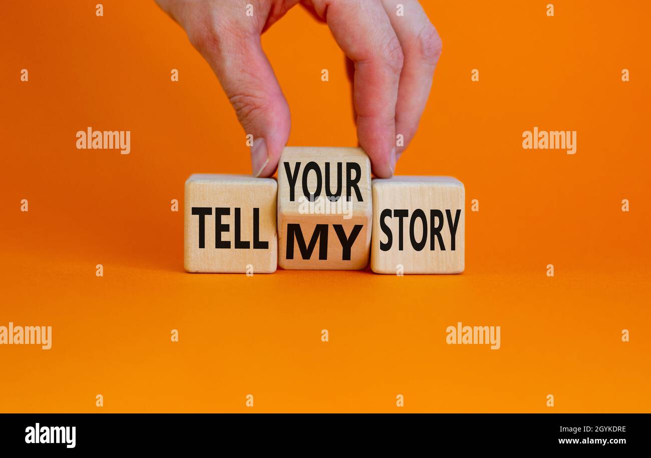 Tell my or your story. Businessman turns wooden cubes, changes words ...
