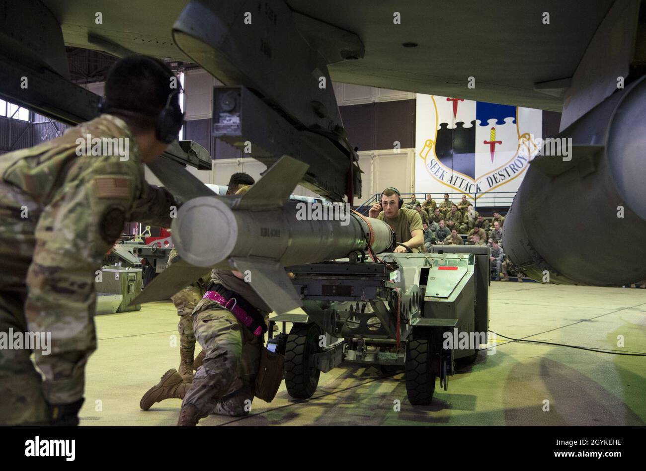 Members of the 52nd Aircraft Maintenance Squadron align an inert ...