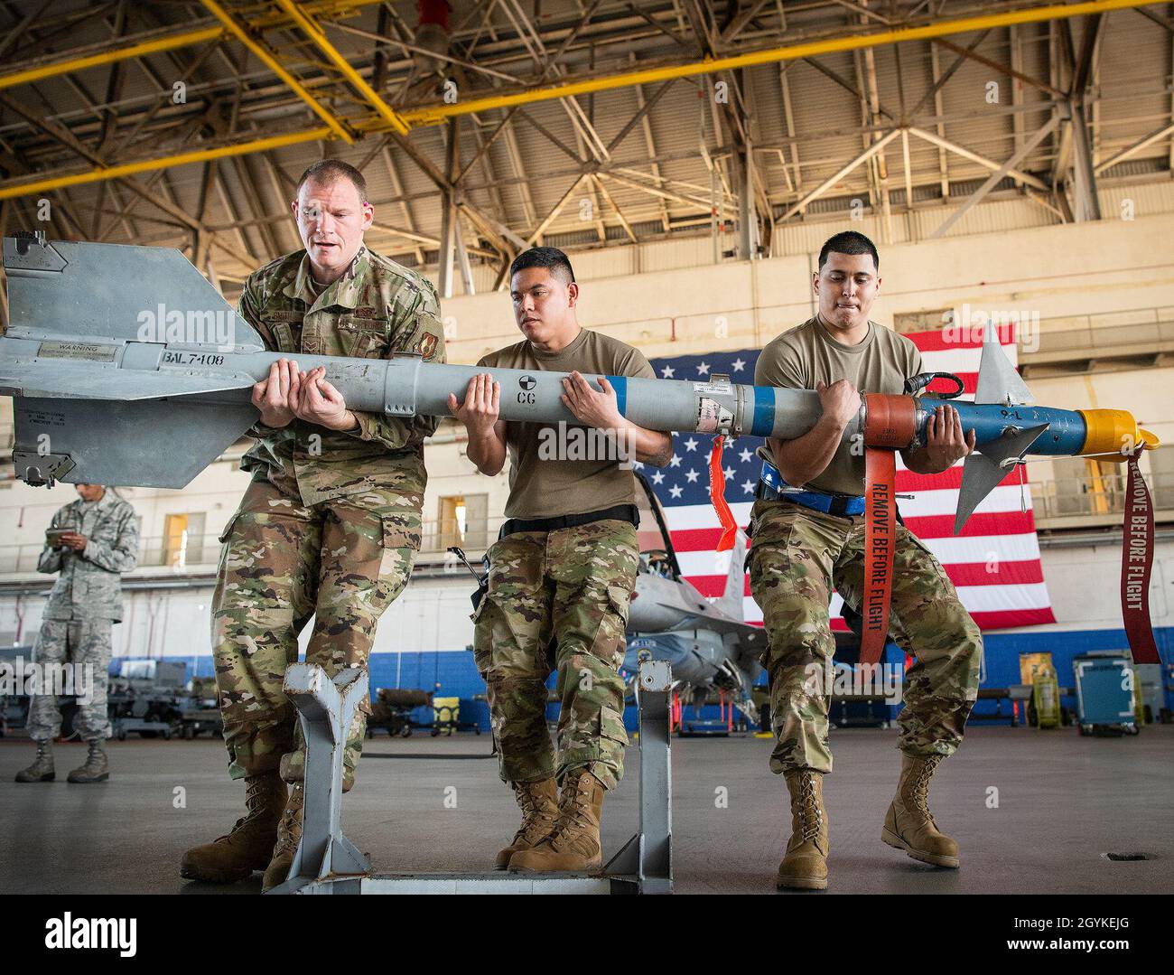 The 96th Aircraft Maintenance Squadron Blue team pick up an AIM-9 at ...