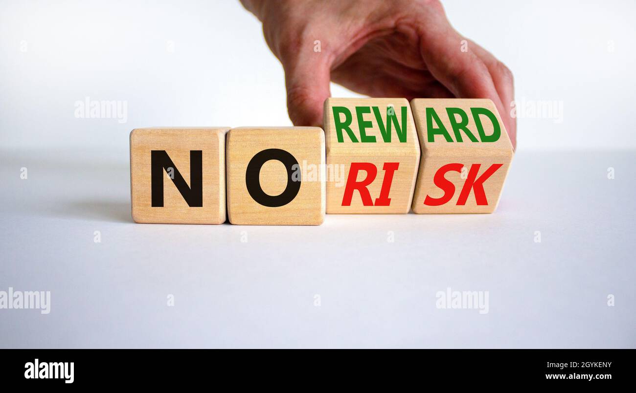 No risk or reward symbol. Businessman turns wooden cubes and changes ...