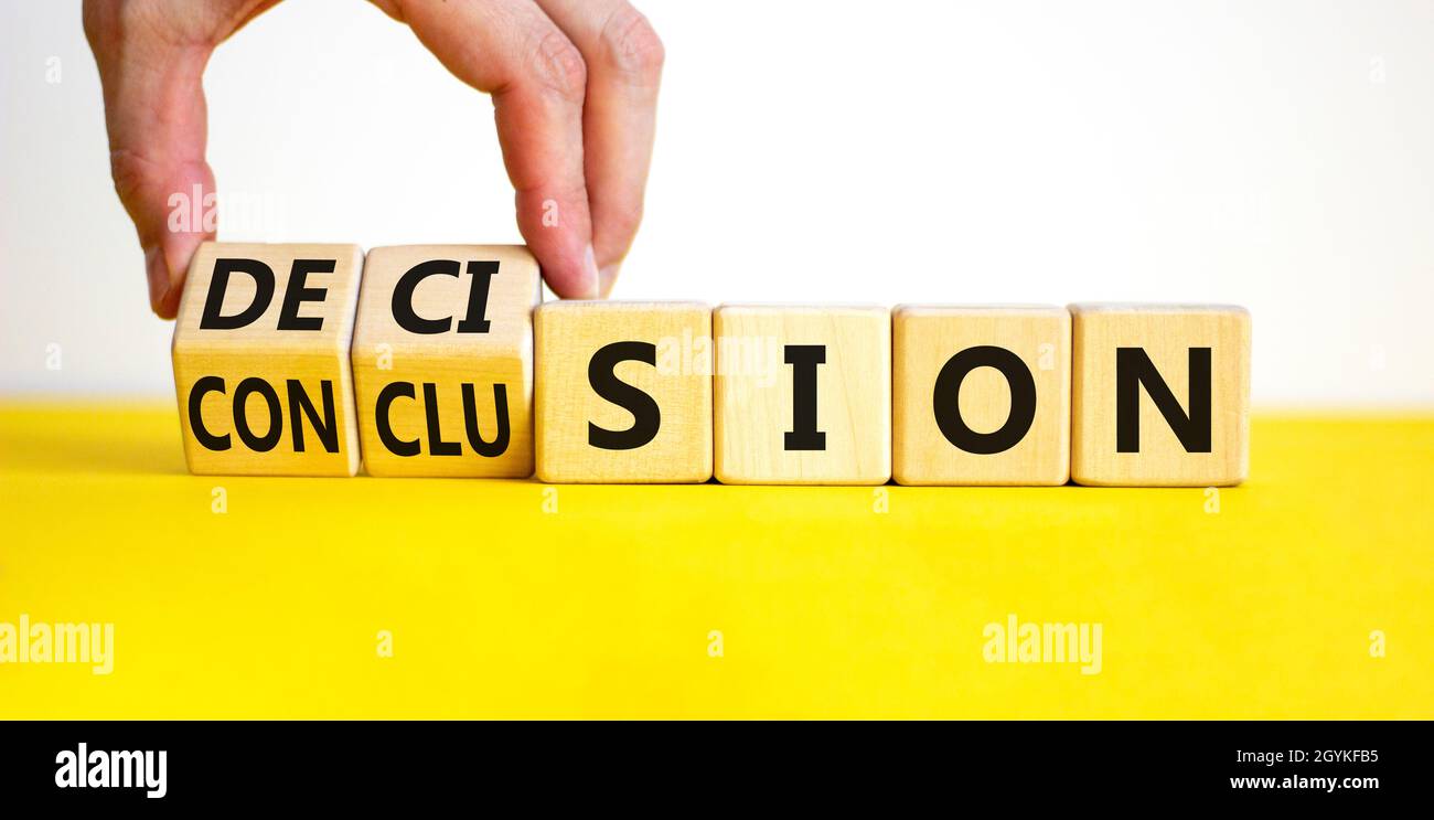 Decision or conclusion symbol. Businessman turns wooden cubes and ...