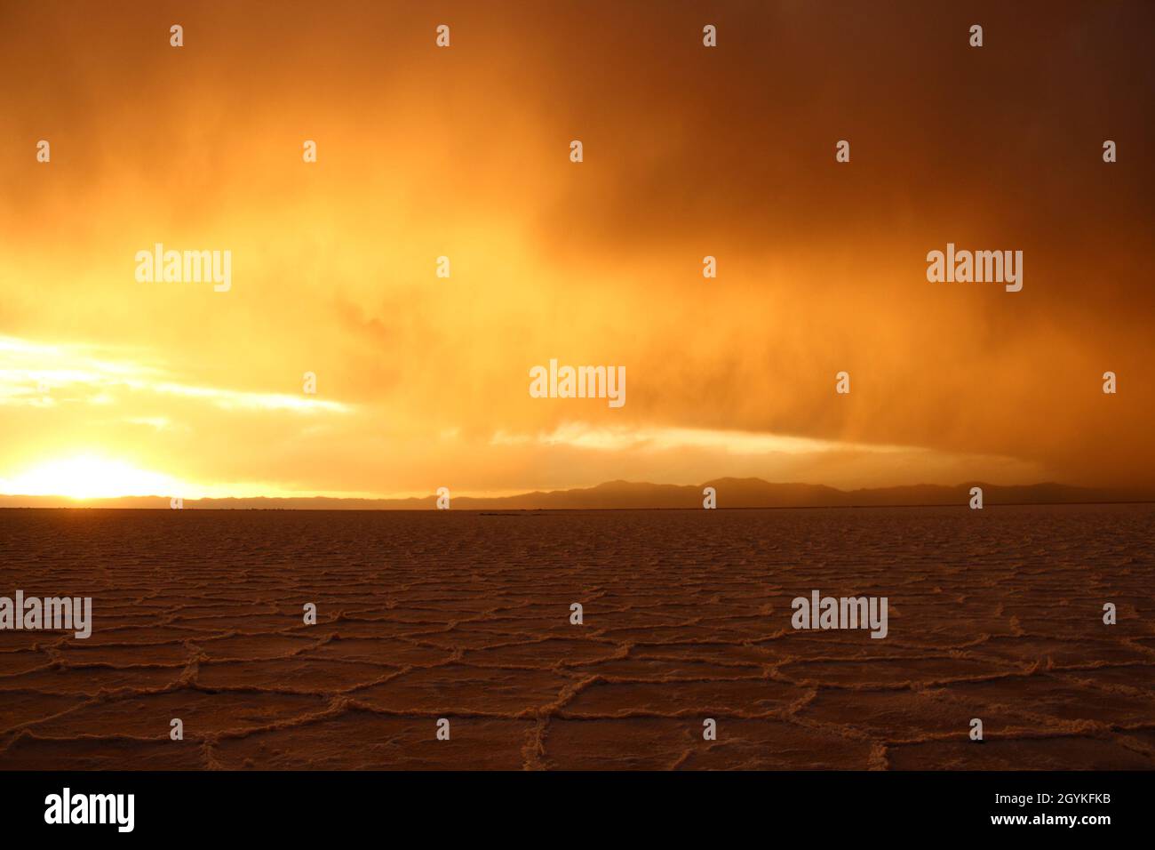 Storm at salt flat desert on sunset Stock Photo - Alamy