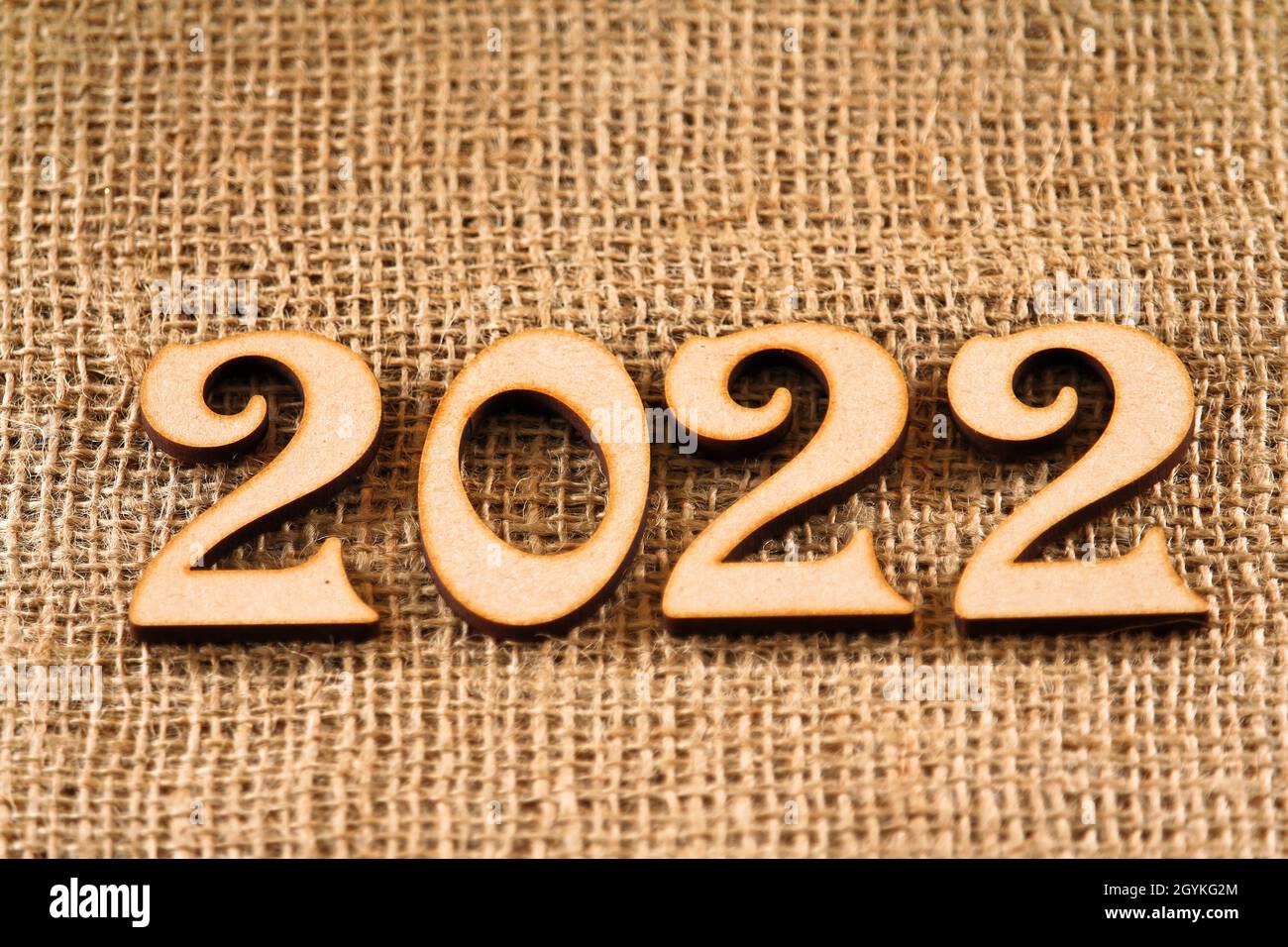 Happy New Year. The number 2022 on brown background Stock Photo - Alamy