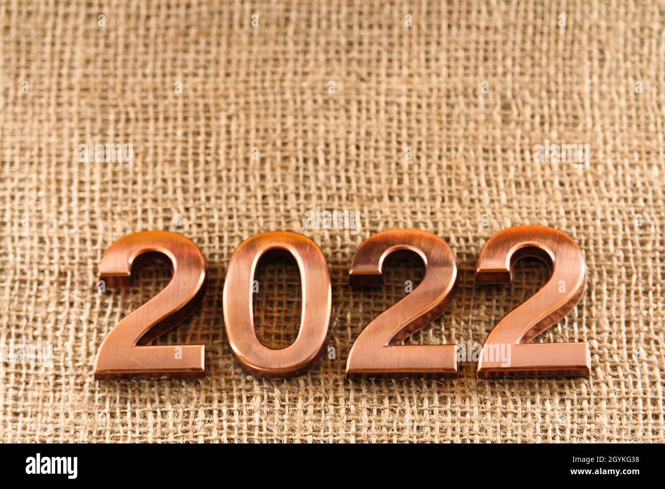 Happy New Year. The number 2022 on brown background Stock Photo - Alamy