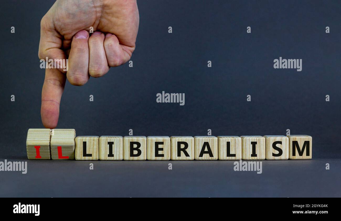 Illiberalism or liberalism symbol. Businessman turns cubes and changes ...