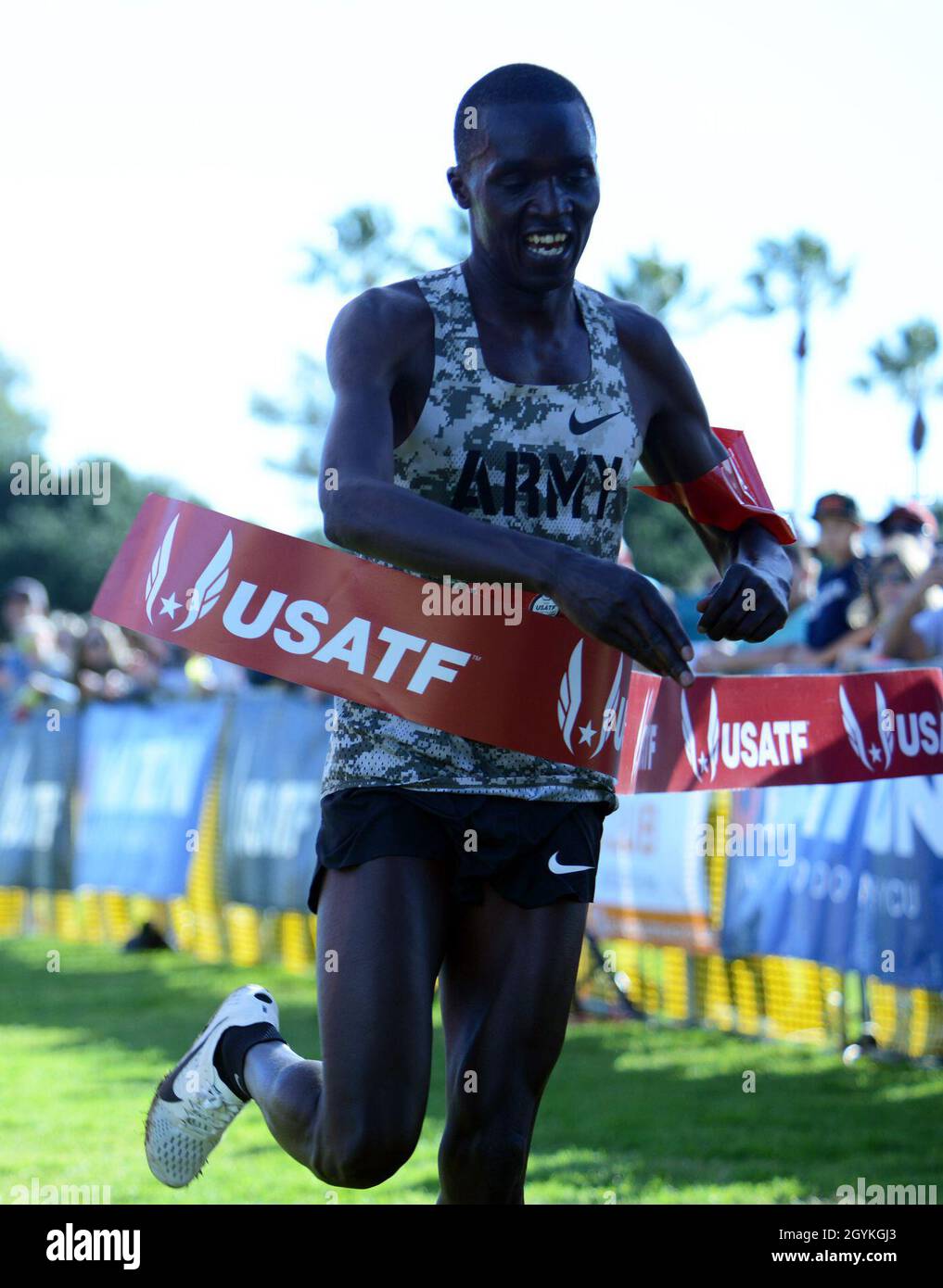 Cpl. Anthony Rotich of Fort Carson, Colo., crosses the finish line with ...