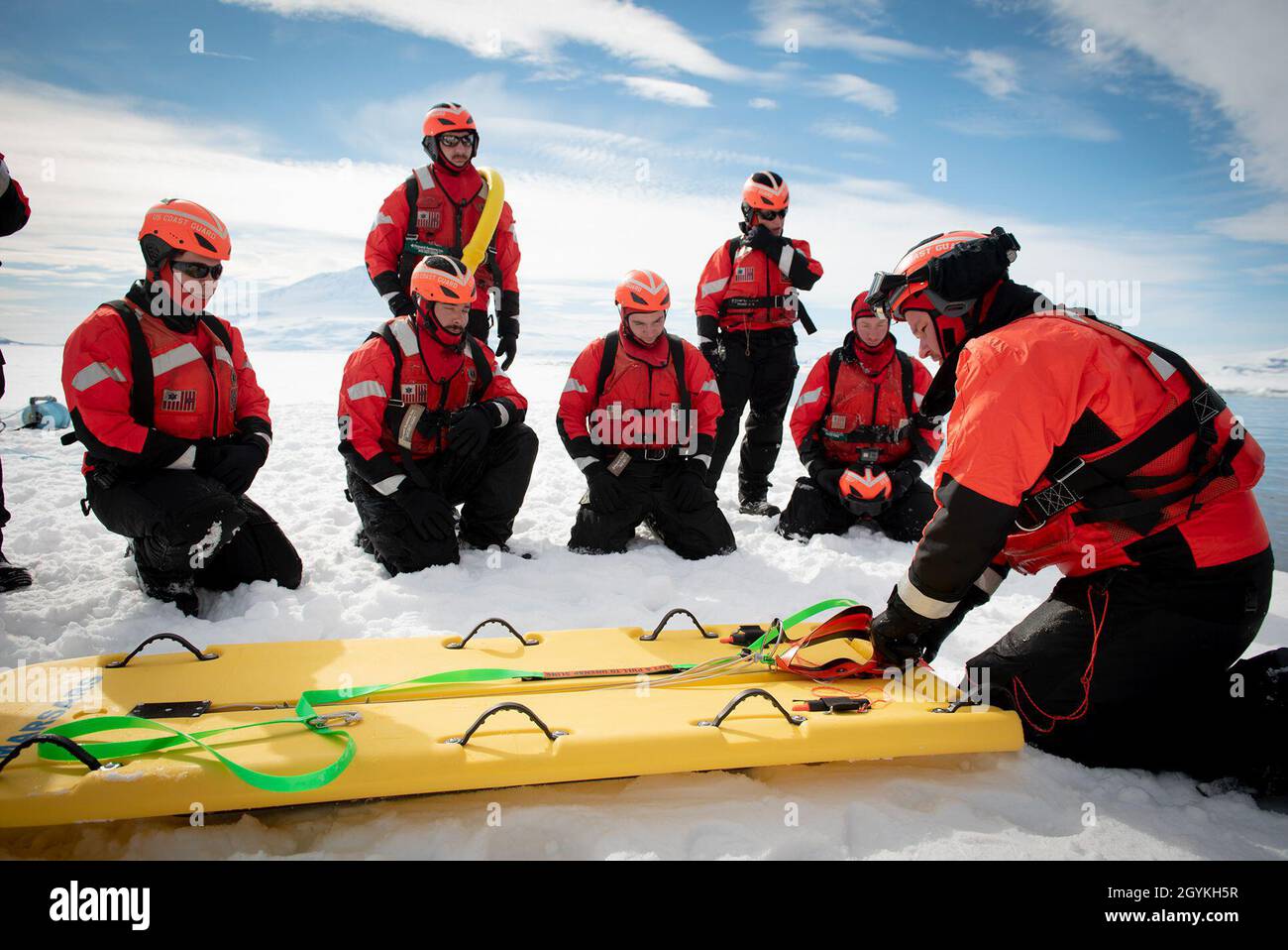 U.S. Coast Guard Petty Officer 1st Class John Mathis prepares a sled ...