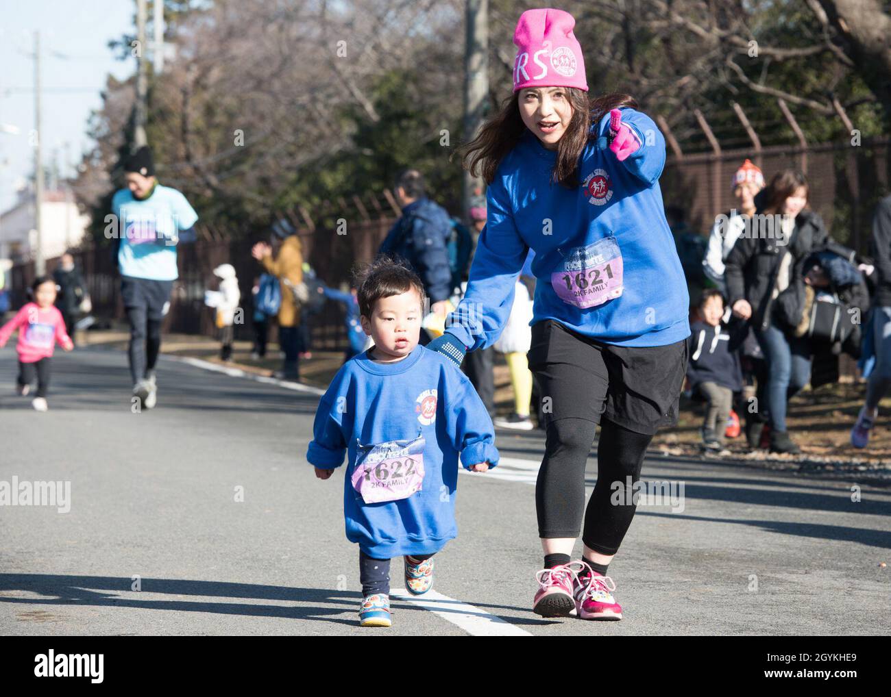 Participants run in a 2K Family Race during the 39th Annual Frostbite ...