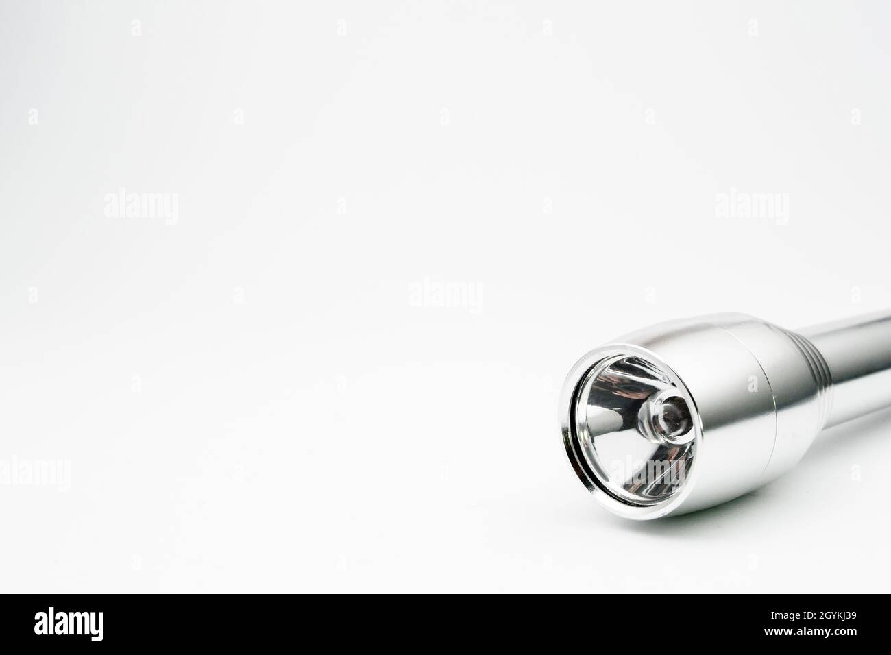 silver flashlight with isolated empty background Stock Photo - Alamy