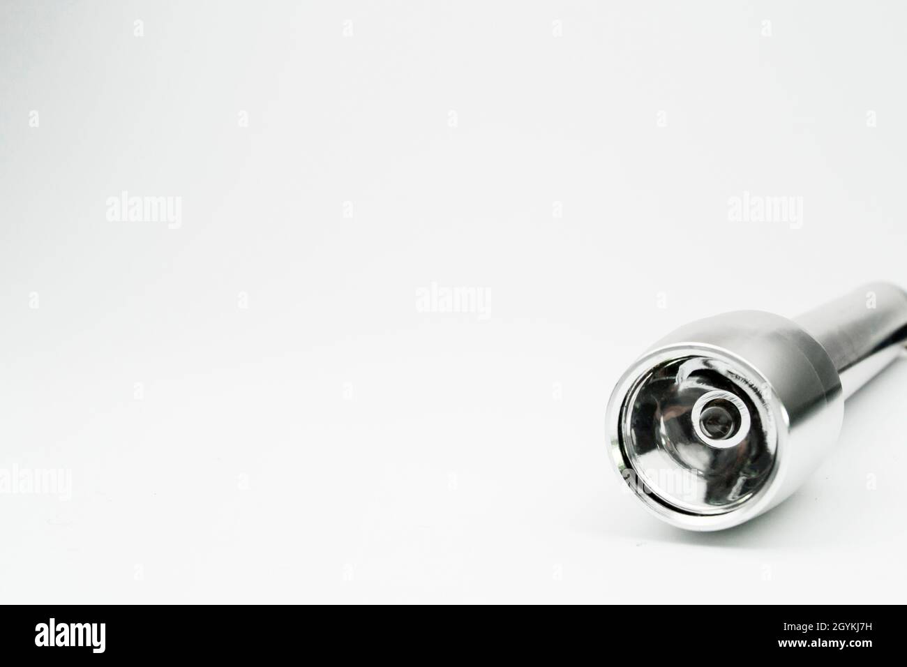 silver flashlight with isolated empty background Stock Photo - Alamy