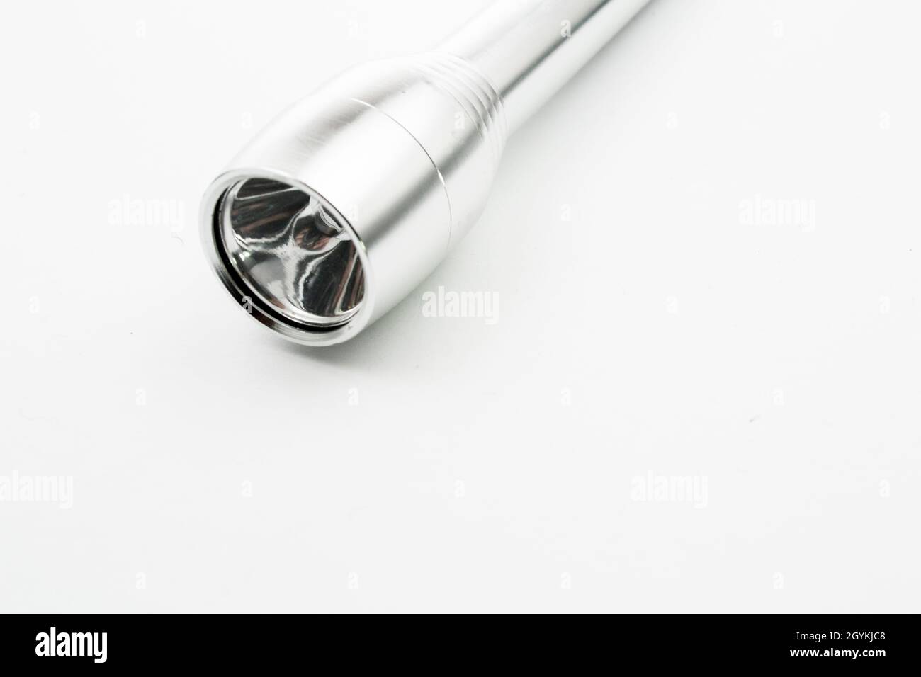 silver flashlight with isolated empty background Stock Photo - Alamy