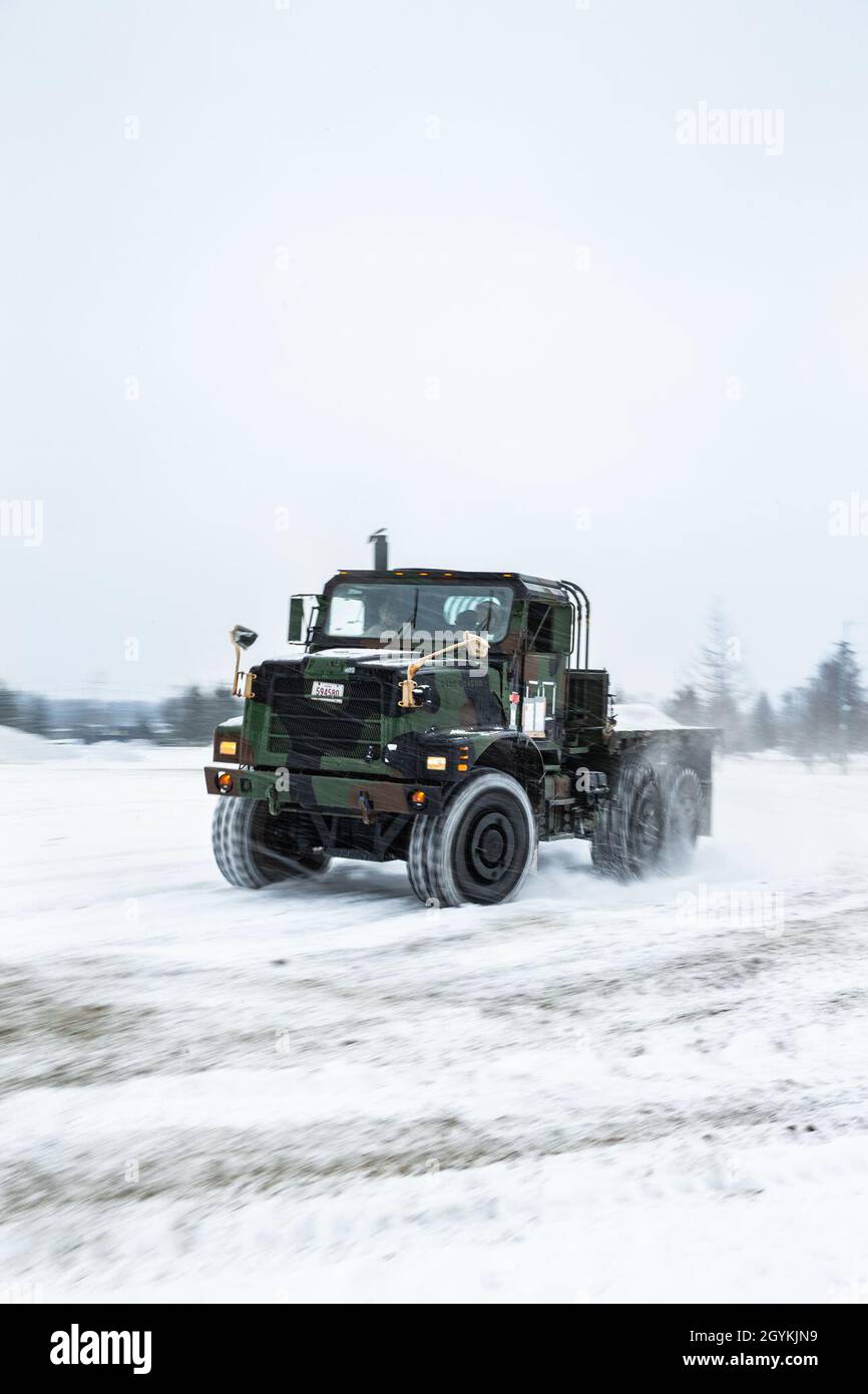 U.S. Marine Corps Lance Cpl. Lexi Legrand maneuvers a 7-ton during ...