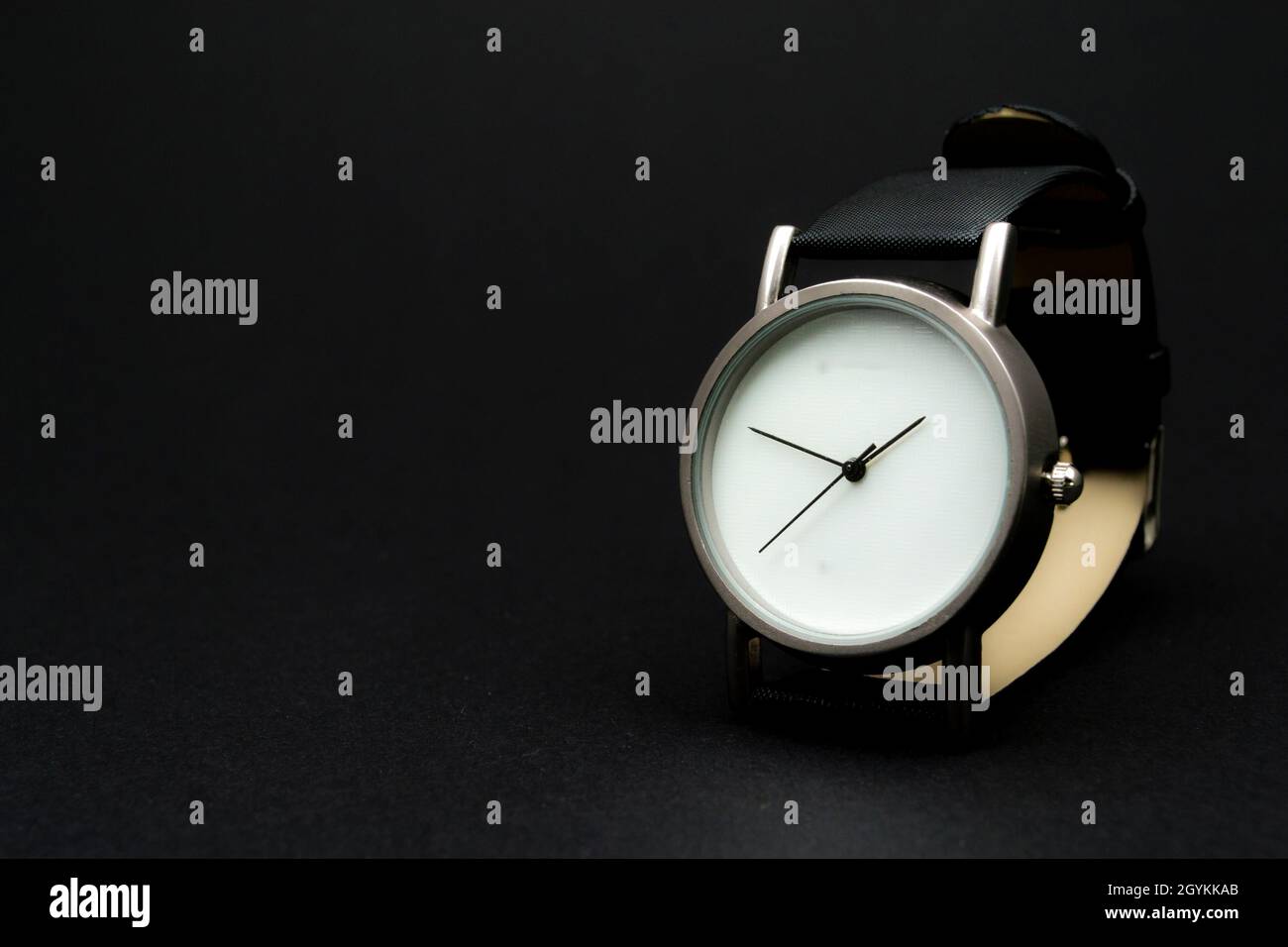 men's watch with a white dial. without numbers. dark background Stock ...