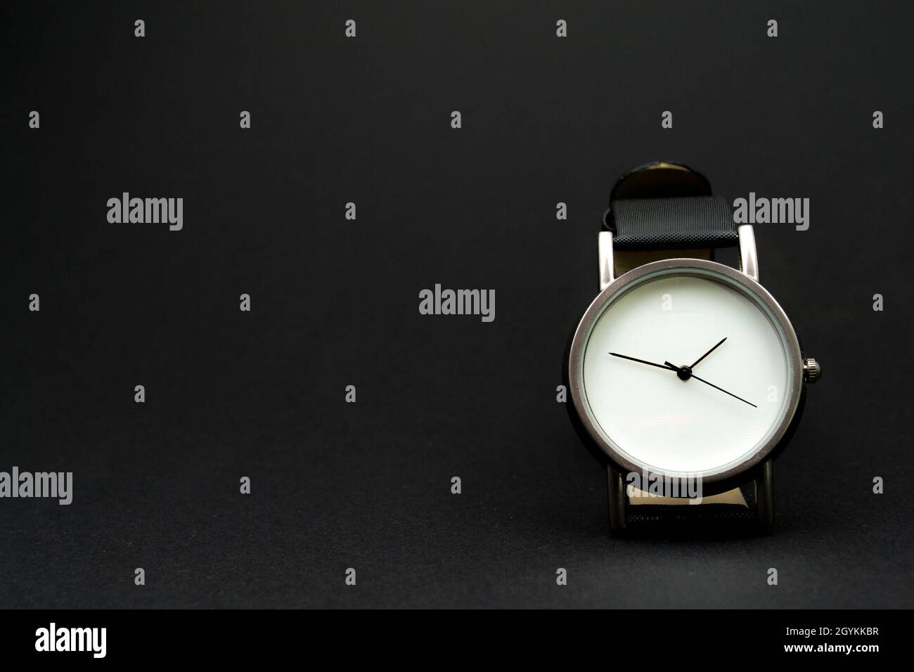 men's watch with a white dial. without numbers. dark background Stock ...