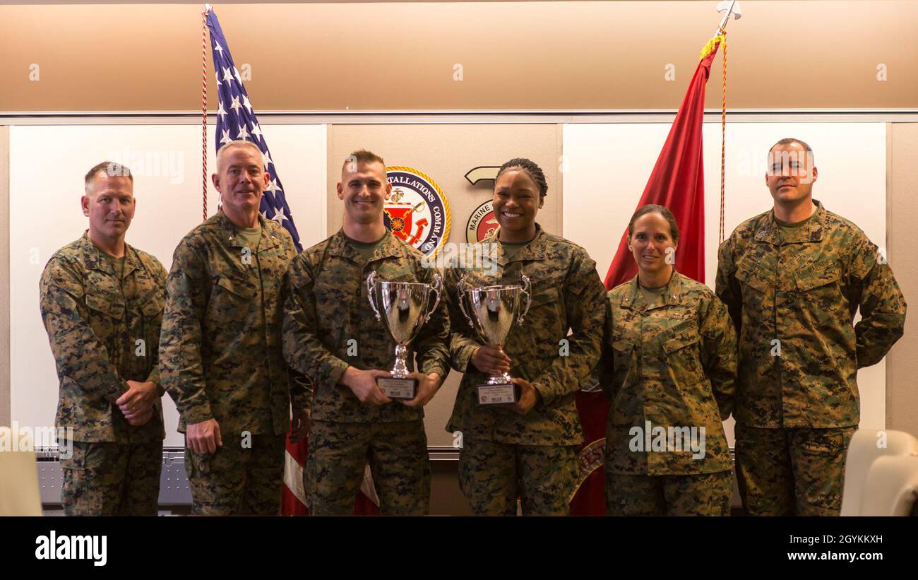 U.S. Marine Corps Sgt. Kevin Fisch, center left, a motor transportation ...