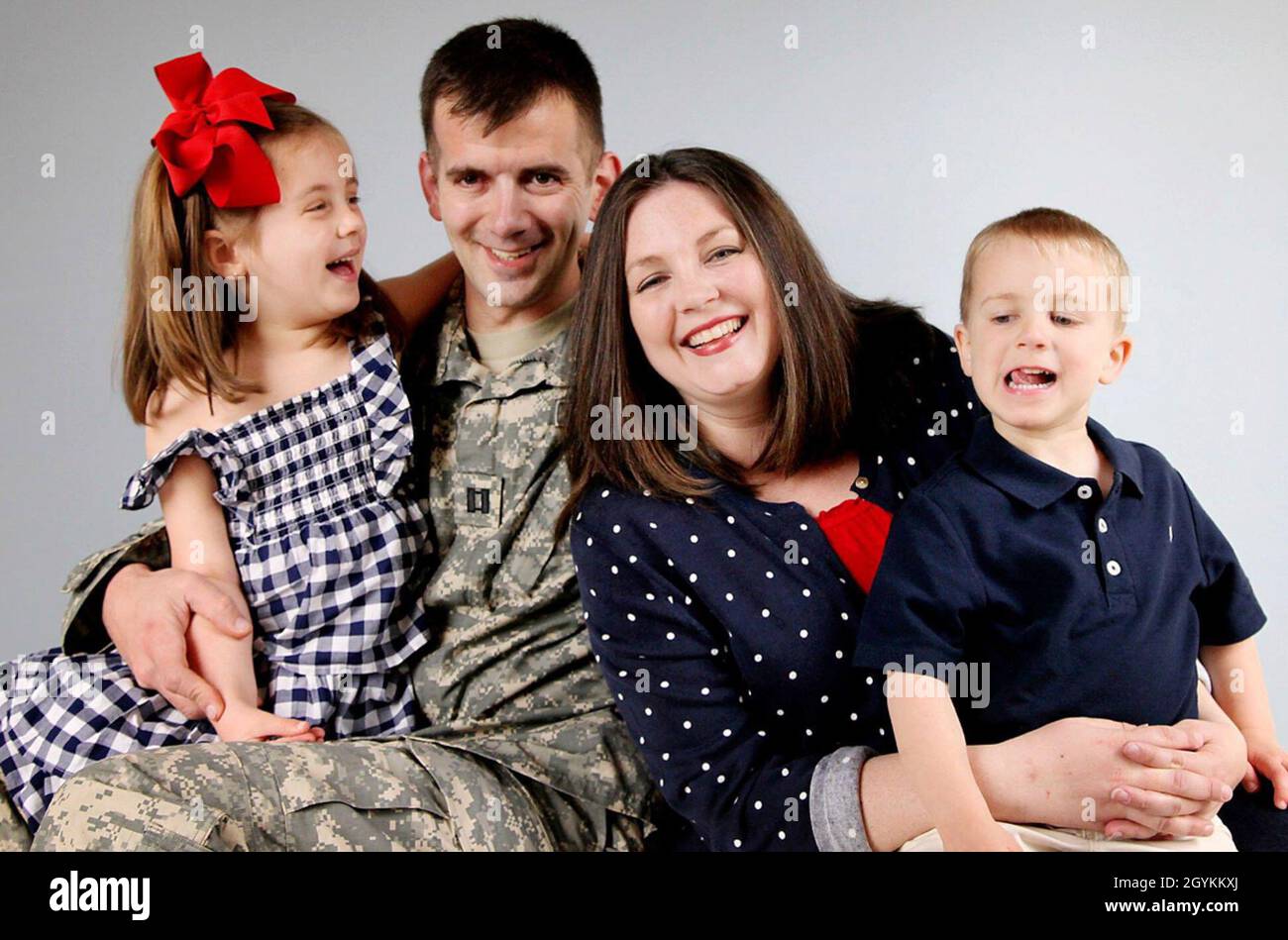 Maj. Wesley Ward poses with his wife, Regina, and two children Stock ...
