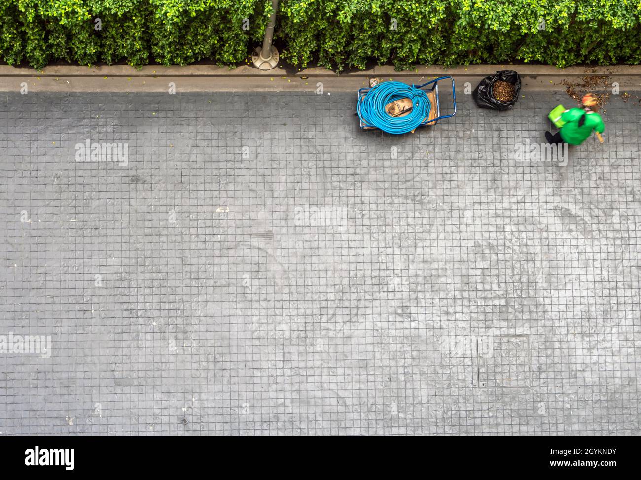 Directly above view the street cleaning worker Stock Photo - Alamy