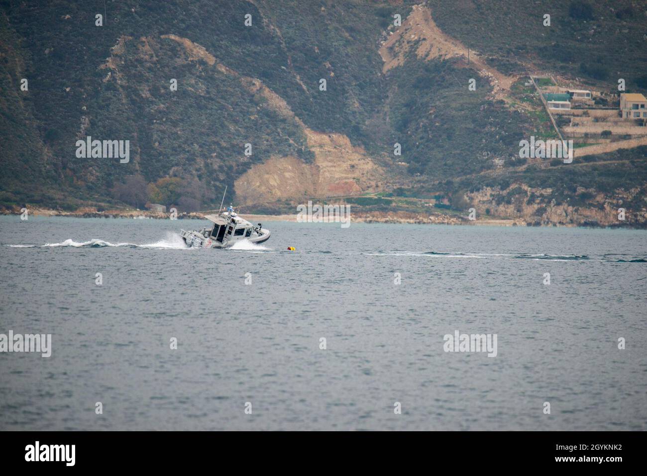 A Naval Support Activity Souda Bay, Greece harbor patrol boat performs ...