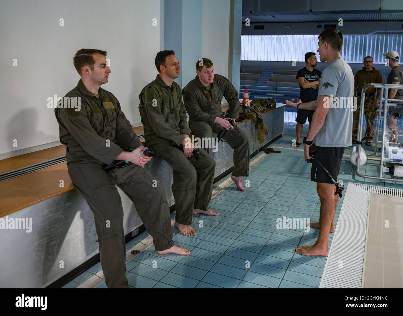 U.S. Air Force Airmen from the 31st Operations Group, are briefed about ...
