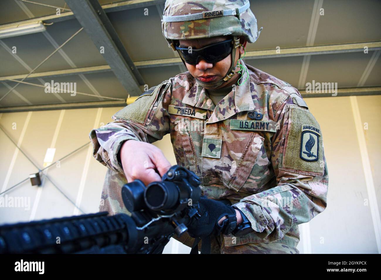 A U.S. Army Paratrooper assigned to the 173rd Airborne Brigade adjusts ...