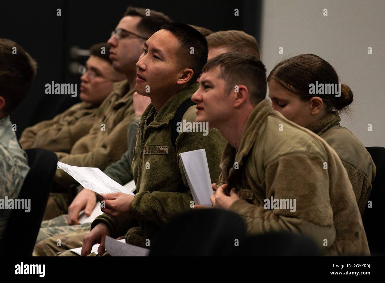 U.S. Air Force Airmen from the 52nd Logistics Readiness Squadron listen ...