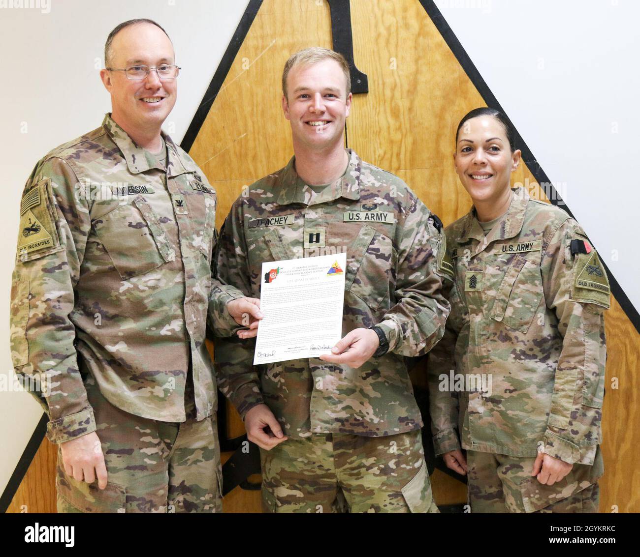 Capt. Adam Teachy poses with the 1st Armored Division Resolute Support ...