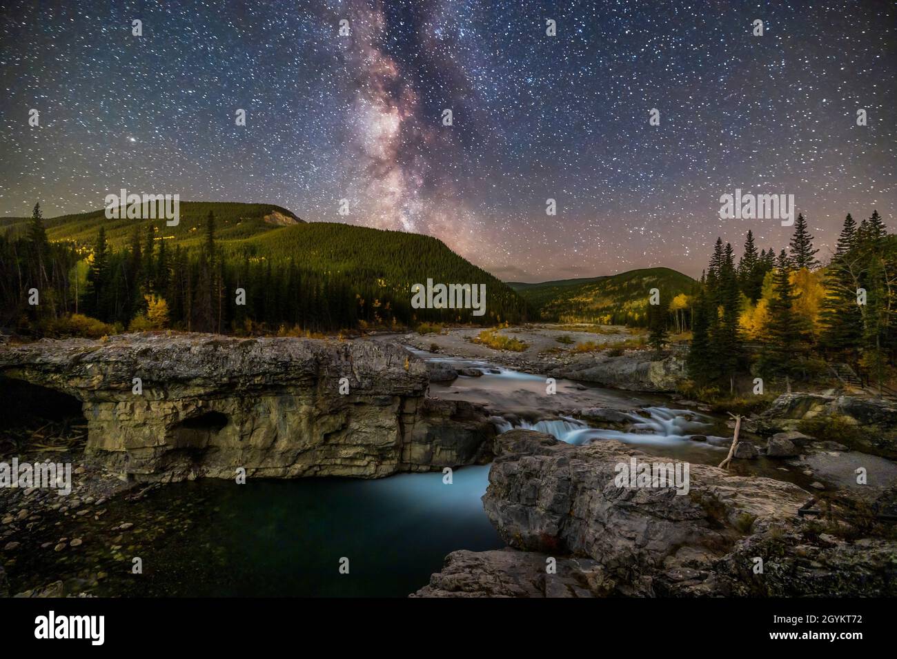 A nightscape scene of the summer Milky Way over the Elbow River and ...